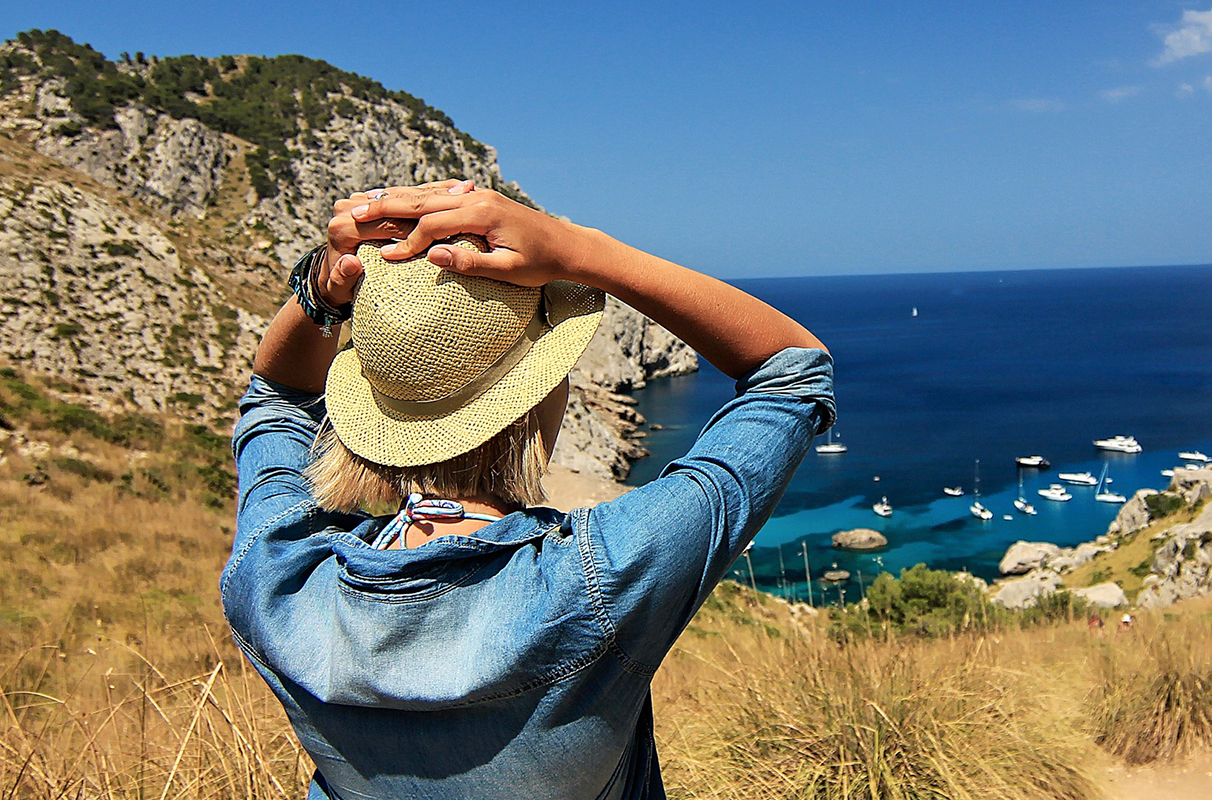 travel-desire-woman-coastline | WSU Insider | Washington State University